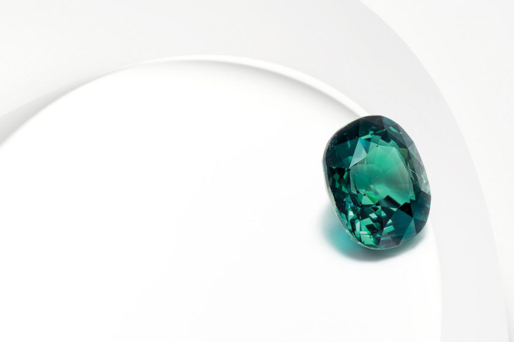 What makes precious gemstones more valuable than semi-precious gems?