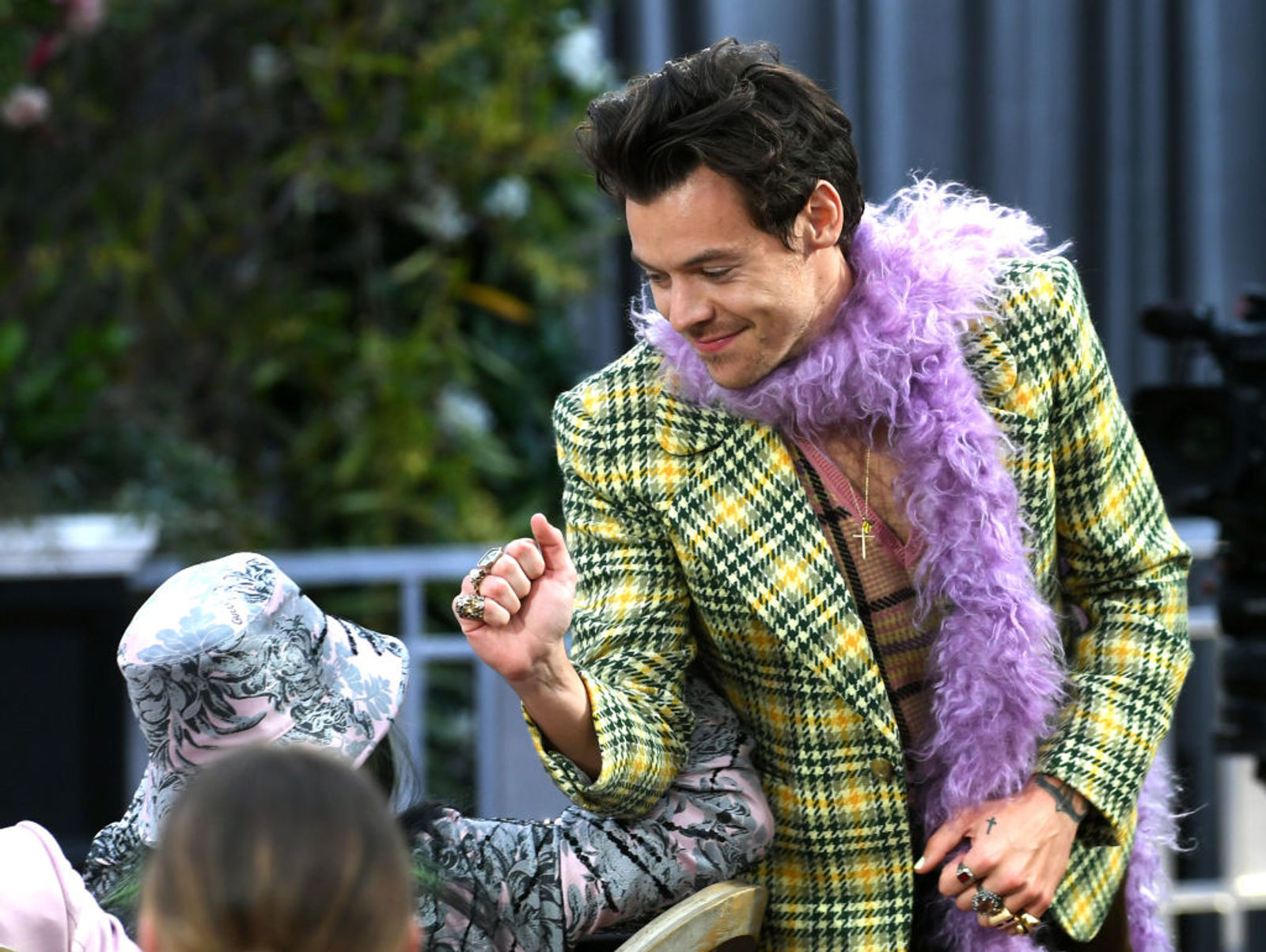 Harry Styles is bringing back the coolest accessory ever, the feather boa